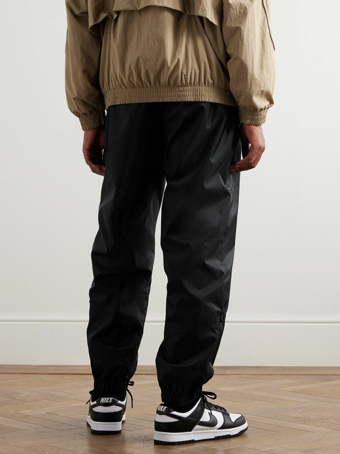 Nike - Windrunner Tapered Logo-Embroidered Shell Sweatpants - Black Nike