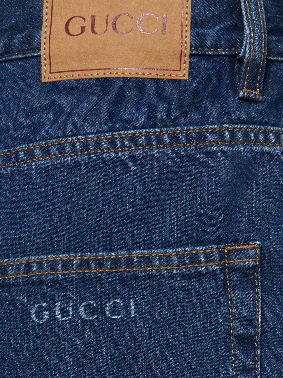 GUCCI Denim Jeans with Lasered Gucci Logo Gucci