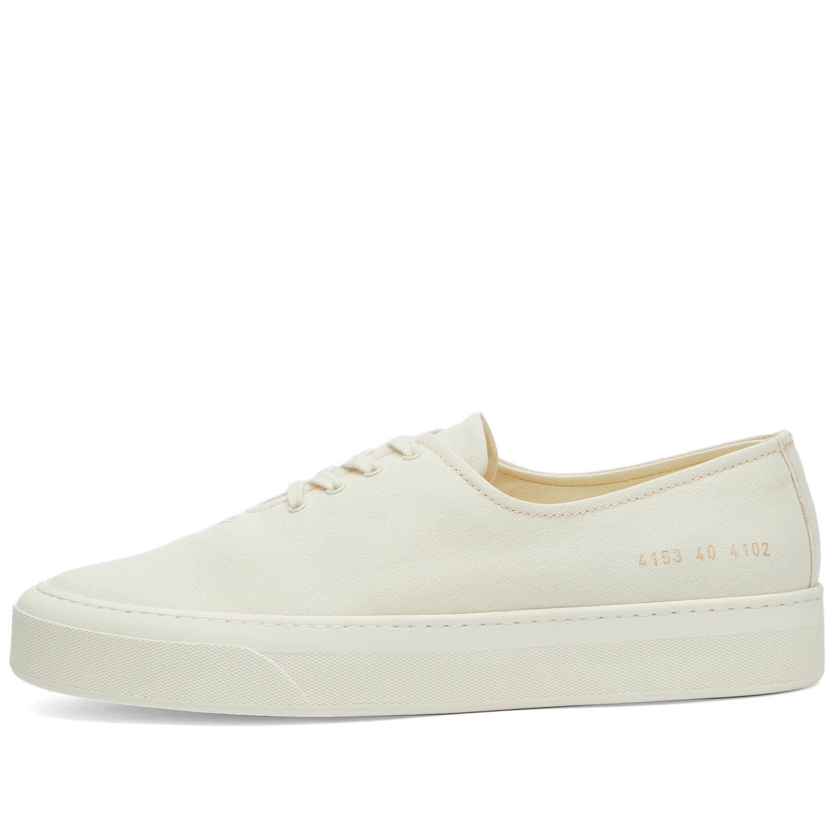 Woman by Common Projects Women's Four Hole Canvas Sneakers in Off White ...