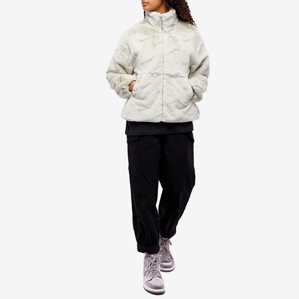 Nike Women's Faux Fur AOP Swoosh Jacket in Light Bone/Light Iron Ore Nike