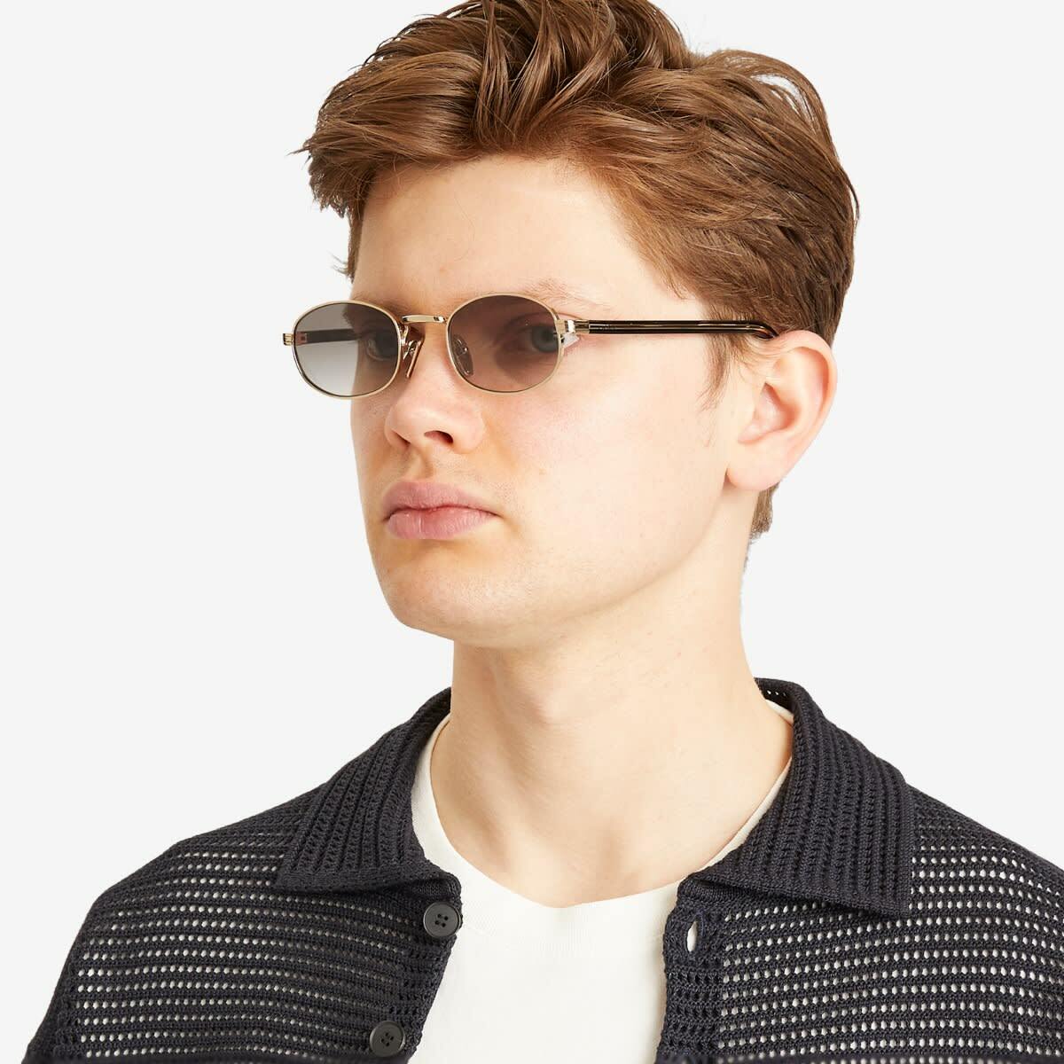 Prada Eyewear 0PR B53S Sunglasses in Pale Gold/Grey Gradient Prada