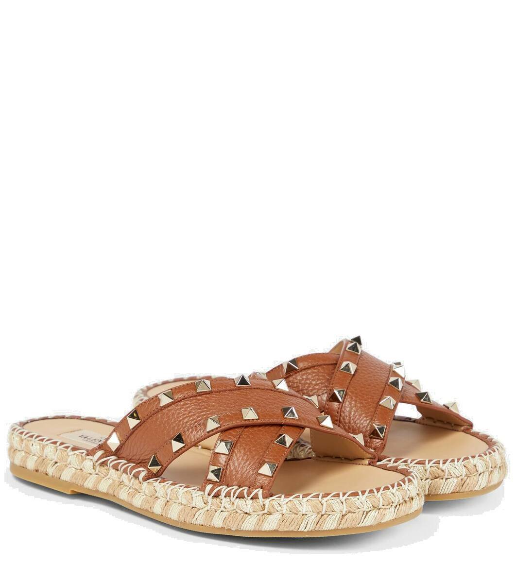 Valentino Garavani Rockstud leather and raffia slides Valentino Garavani