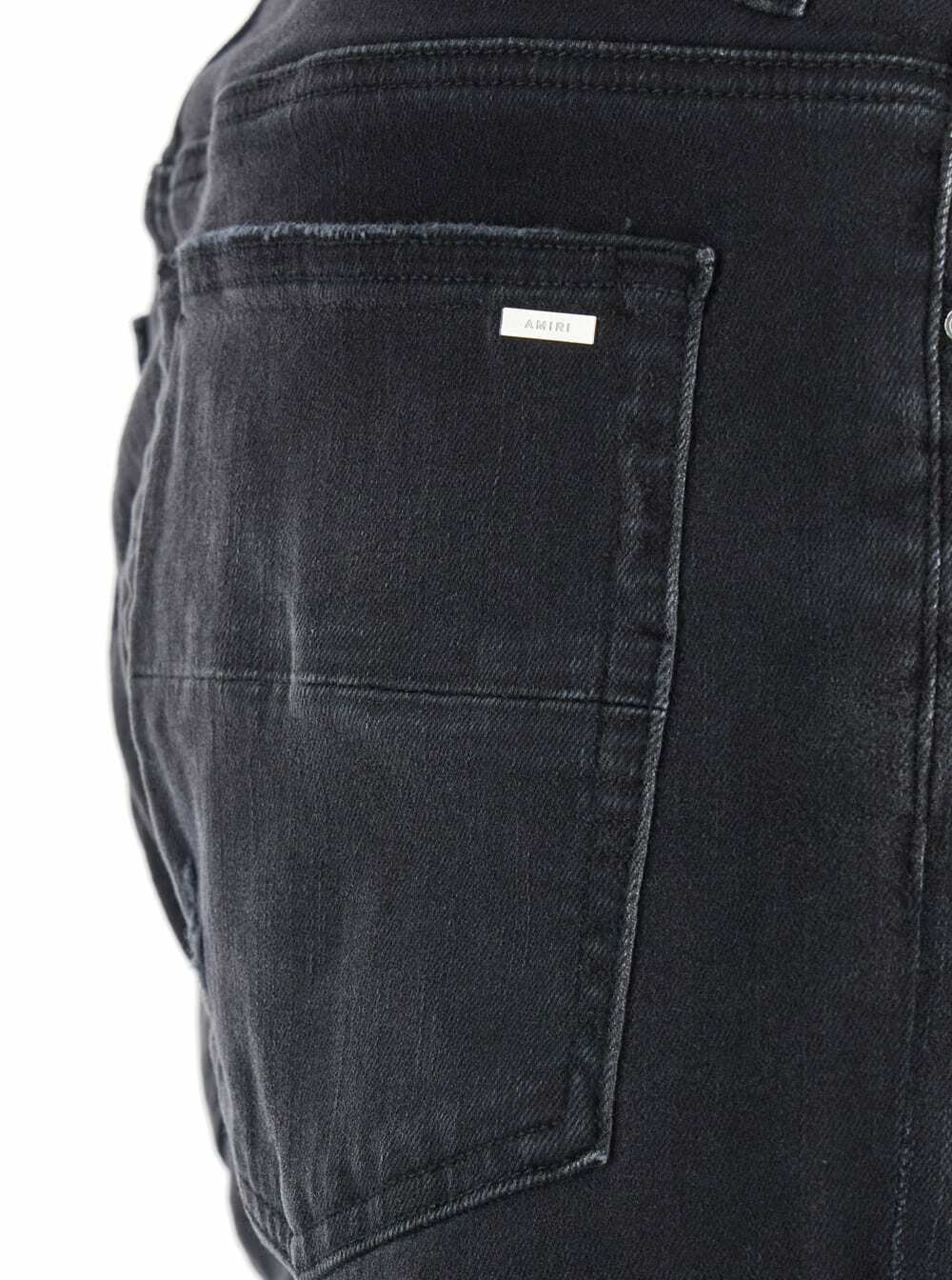 AMIRI Black Jeans With Ripped Details On The Front And Logo Patch On ...