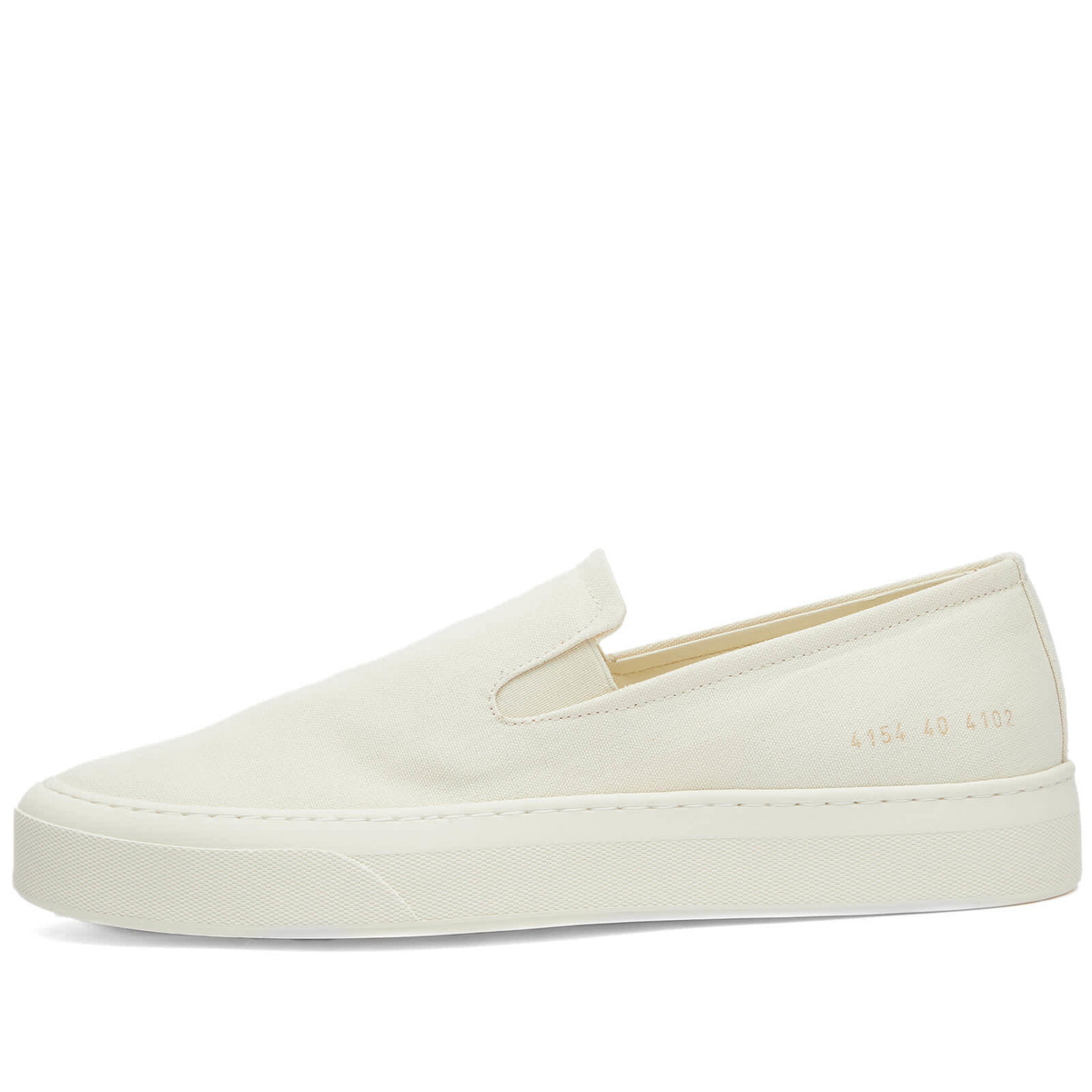 Woman by Common Projects Women's Slip on Canvas Sneakers in Off White ...