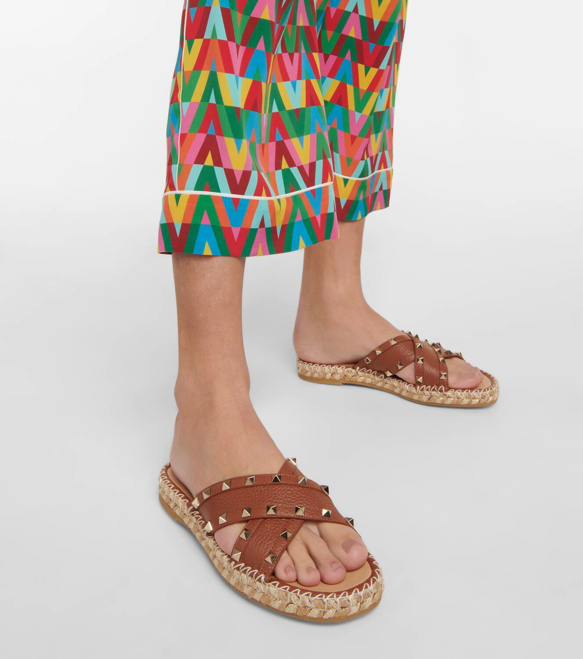 Valentino Garavani Rockstud leather and raffia slides Valentino Garavani