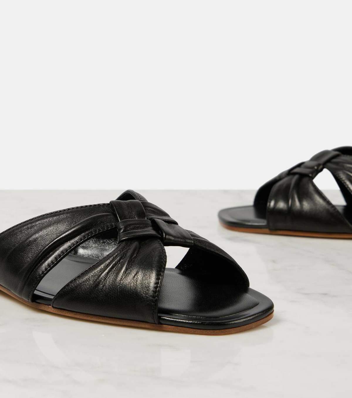 The Row Soft Knot leather slides The Row