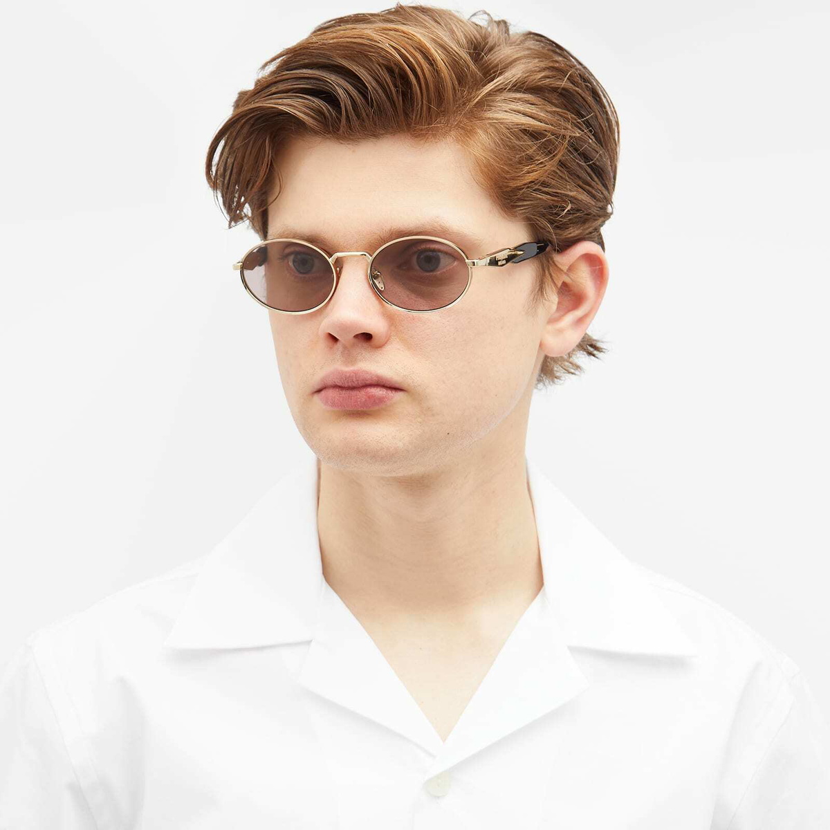 Prada Eyewear 65ZS Sunglasses in Pale Gold/Light Purple Prada